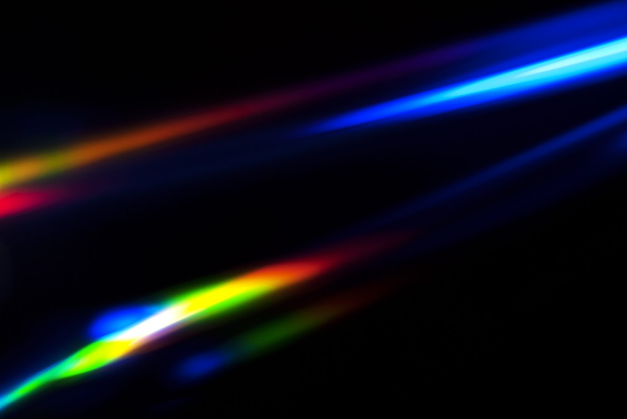 Abstract colorful spectrum in darkness. Colorful rays of light ...